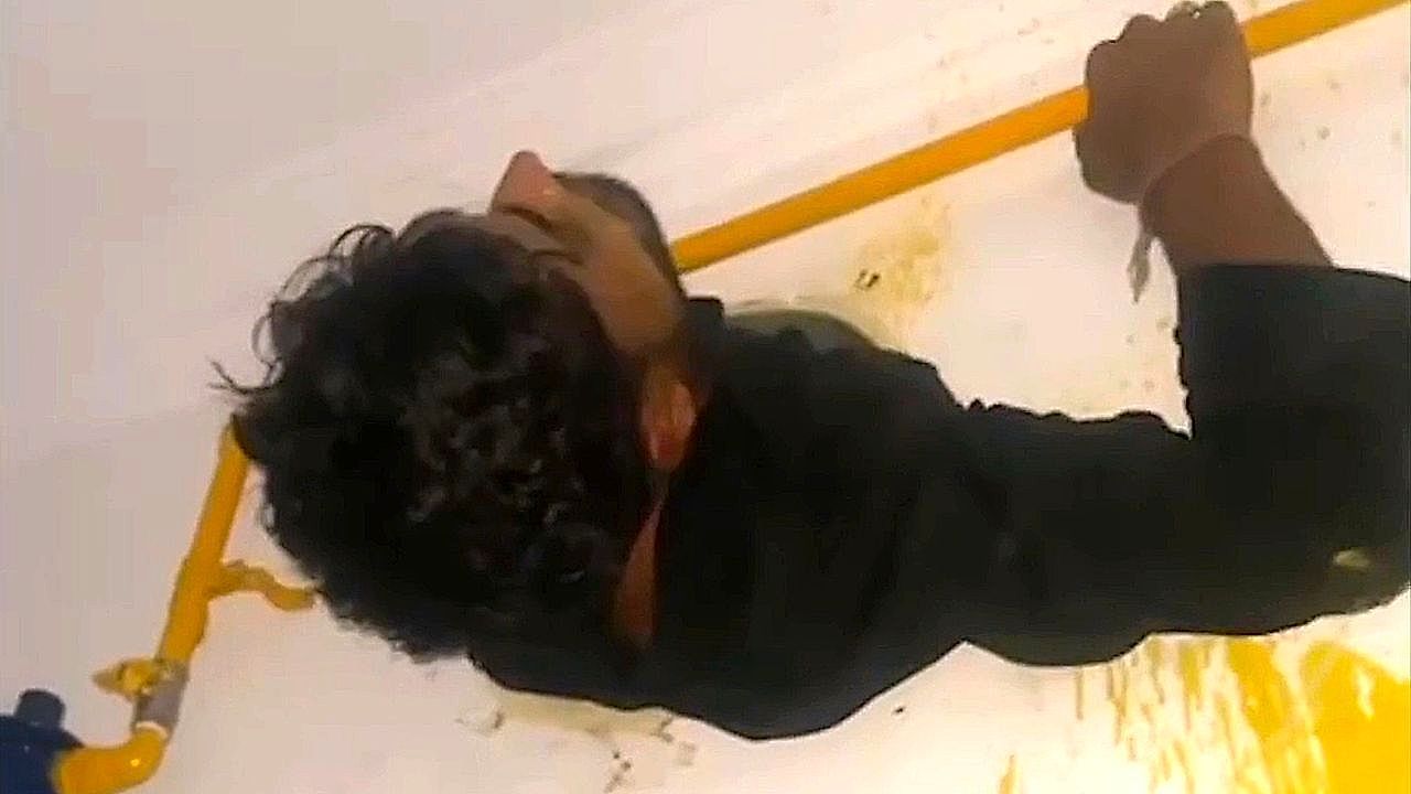 Video: Break-in goes horribly wrong as thief gets stuck inside kitchen ...